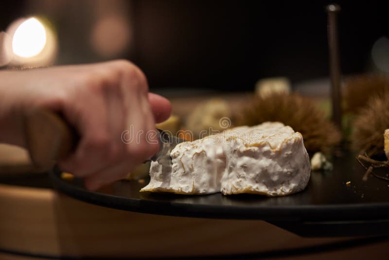 Chef Cutting Piece of Cheese on Board Stock Photo - Image of cooking ...