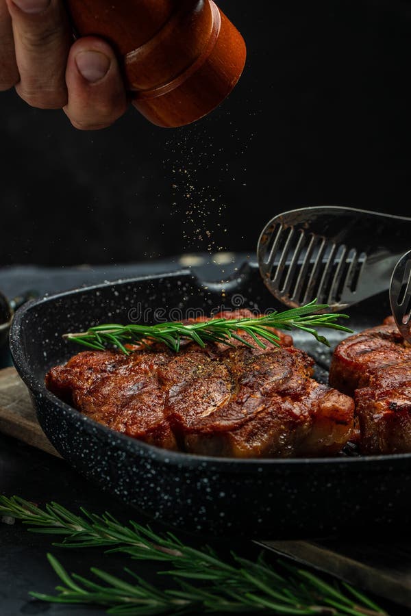 Chef Hands Cooking Meat Steak and Adding Seasoning in a Freeze Motion ...