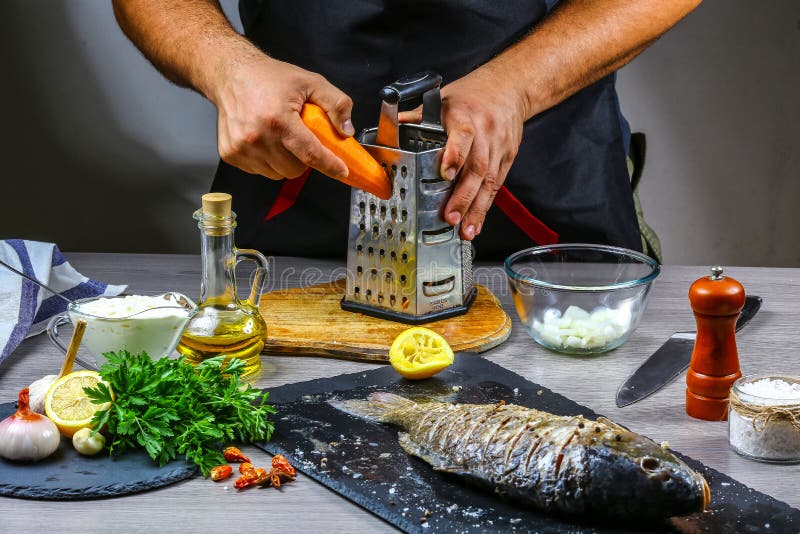 Chef Hands Cooking Vegetable Stuffing for River Carp. Rubbing Carrots ...