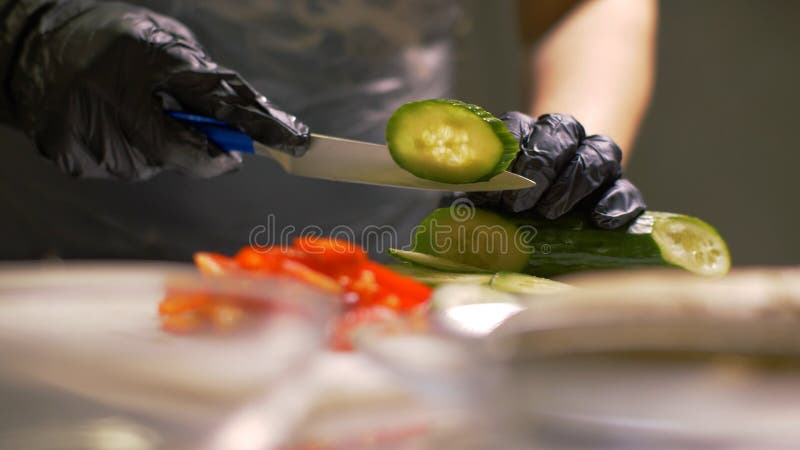Chef Hands Cutting Fresh Cucumber On Round Pieces For Cooking Vegetable