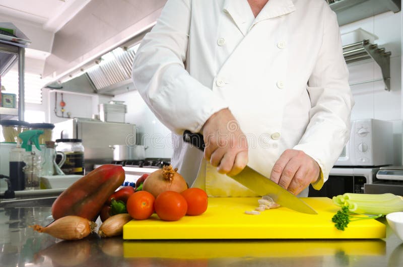 Chef Cutting Vegetables in His Restaurant Kitchen Stock Image - Image ...