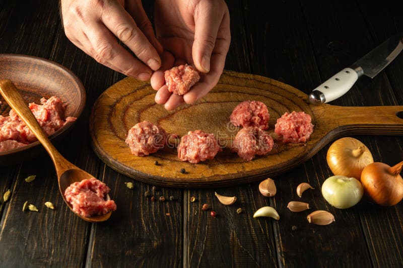 The Chef Hands Form Meatballs from Ground Beef. Concept of Preparing a ...