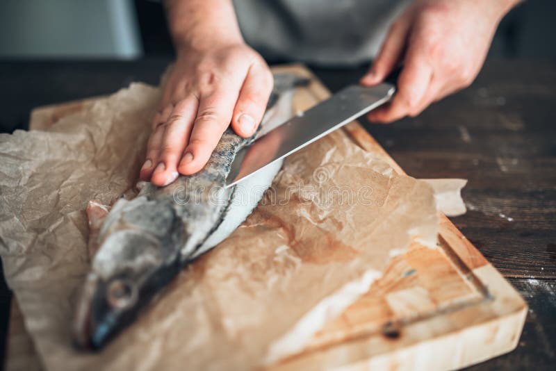 Chef Hands with Knife Cut Up Fish on Cutting Board Stock Photo - Image ...