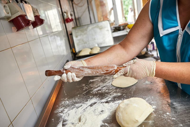 Chef Hands Sprinkle the Rolling Pin with Flour before Rolling Out the ...
