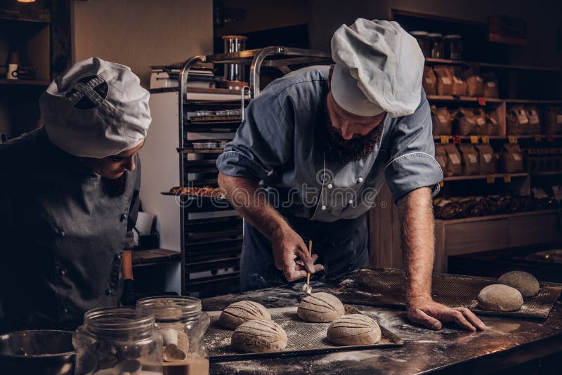 Cooking Master Class in Bakery. Chef with His Assistant Showing Ready ...