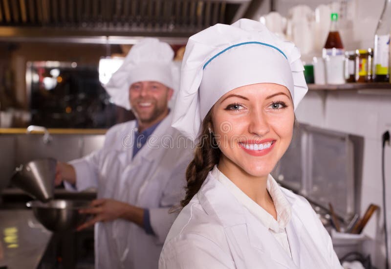 Chef and His Helper at Bistro Kitchen Stock Image - Image of people ...
