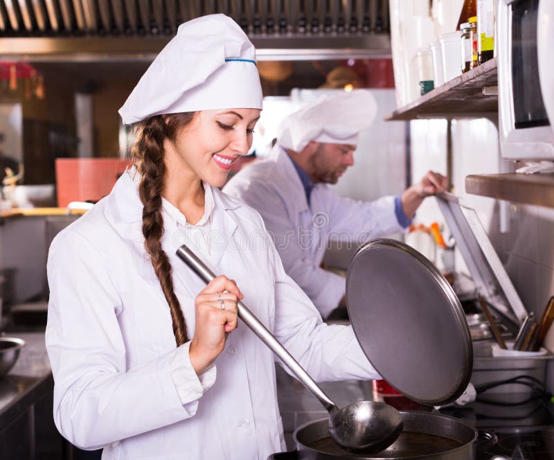 Chef and His Helper at Bistro Kitchen Stock Photo - Image of casual ...