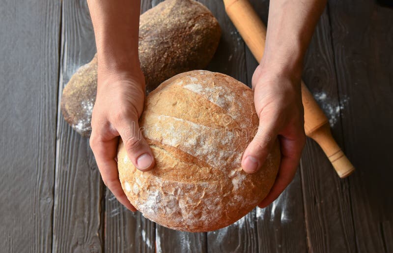 Chef is Holding the Bread Above the Kitchen Table Stock Image - Image ...