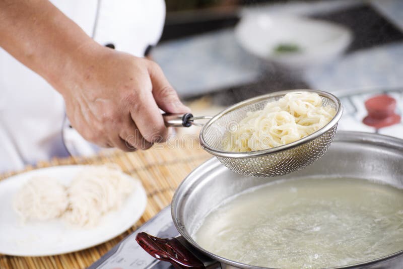 Chef Holding Colander with Cooked Noodle Stock Image - Image of hand ...
