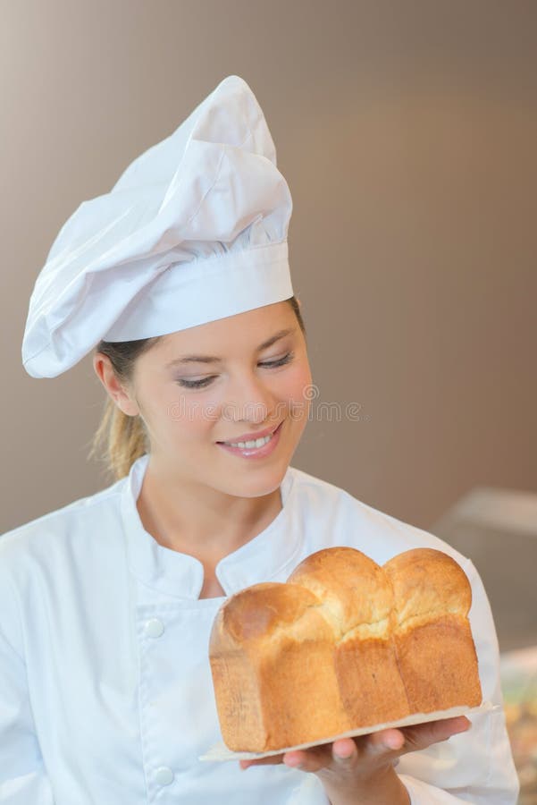 Chef holding loaf bread stock photo. Image of confident - 99650938