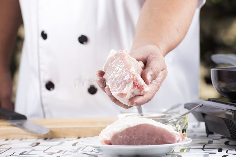Chef holding raw pork stock photo. Image of hand, present - 50063588