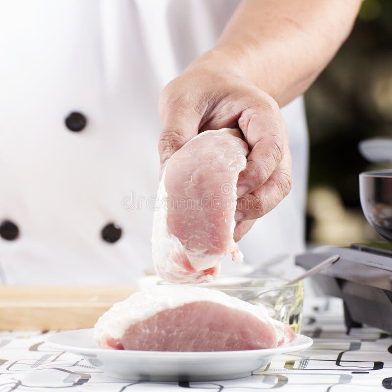 Chef holding raw pork stock image. Image of beef, uncooked - 52191409