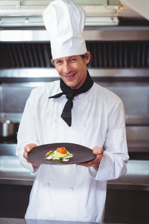 Chef Holding and Showing a Dish Stock Photo - Image of perfect, plate ...