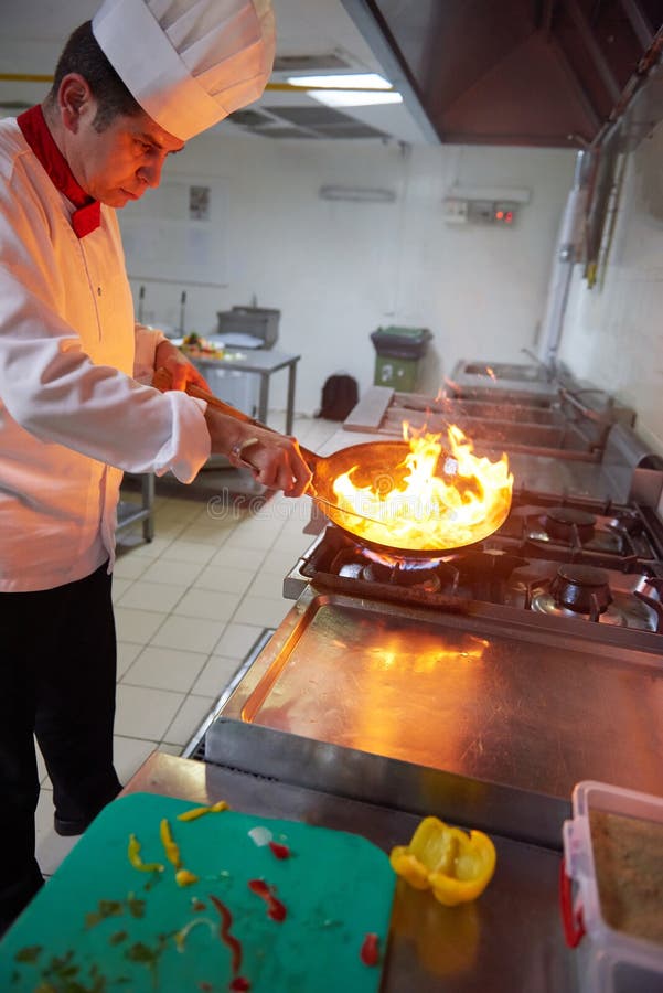 Chef in Hotel Kitchen Prepare Food with Fire Stock Photo - Image of ...