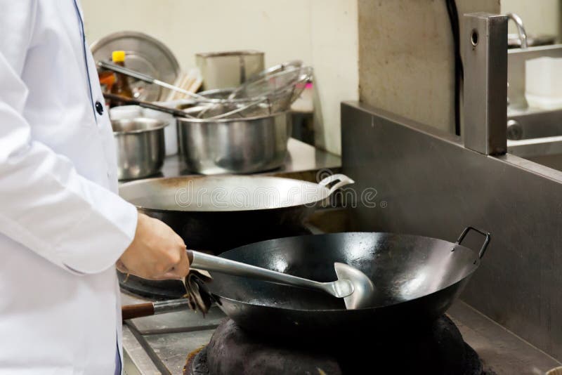 Chef in Hotel or Restaurant Kitchen Busy Cooking Stock Photo - Image of ...