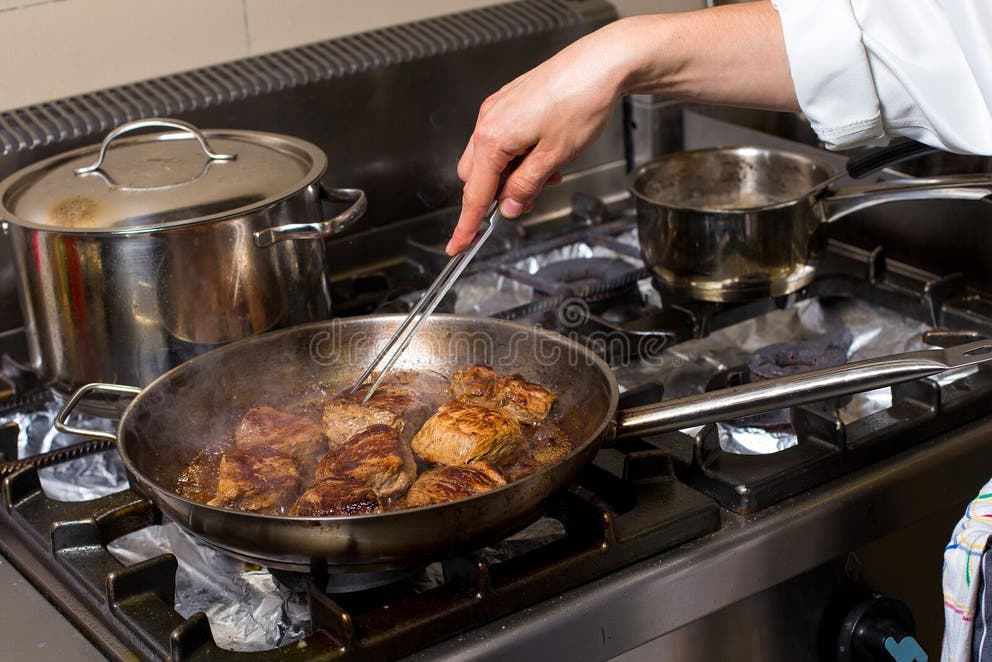 Chef in Hotel or Restaurant Kitchen Cooking, only Hands Stock Photo ...