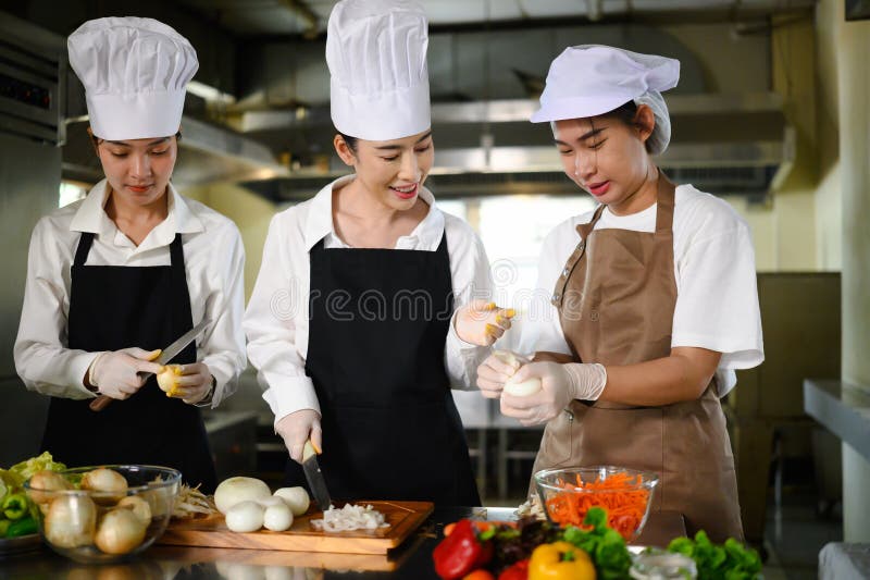 Chef Instructor Guiding Students in Hands on Kitchen Training Stock ...