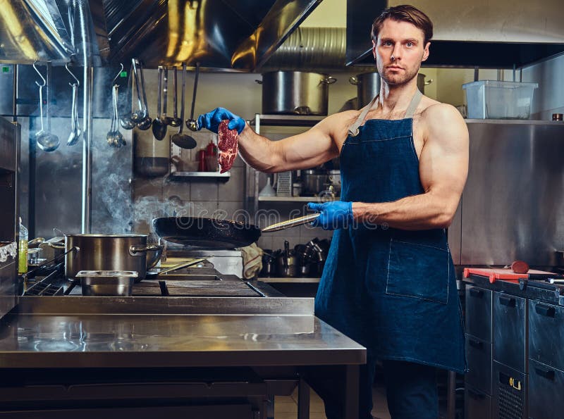 The chef in a kitchen. stock photo. Image of lamb, hotel - 109660978