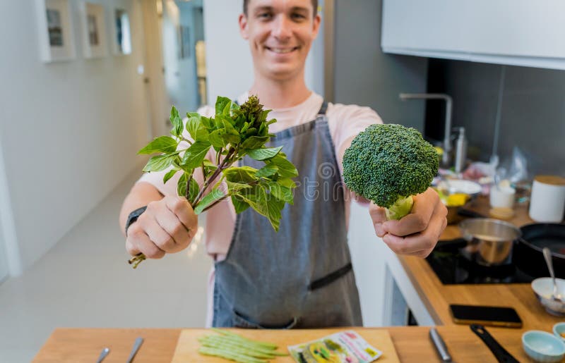 Chef at the Kitchen Preparing Green Curry with Herbs and Rice Stock ...