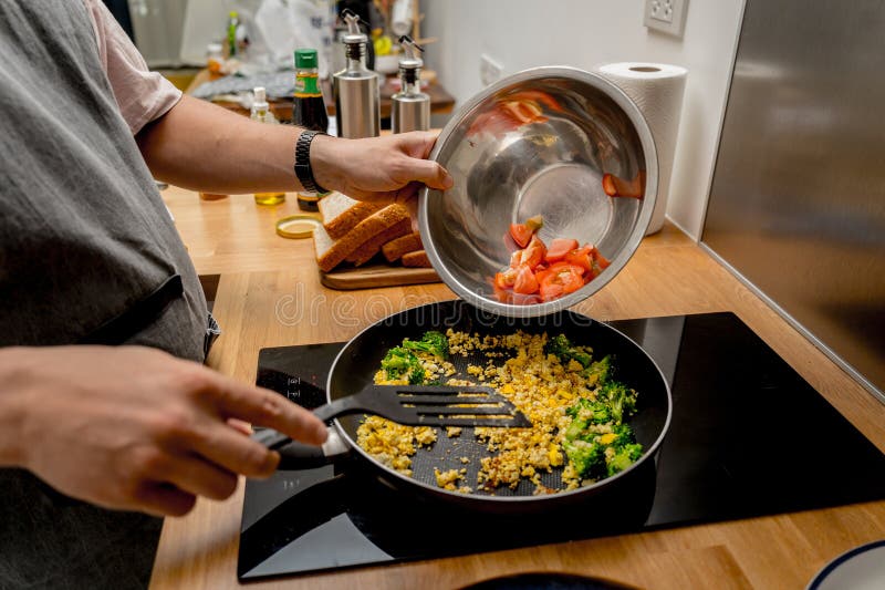 Chef at the Kitchen Preparing Tofu Scramble with Vegetables Stock Image ...