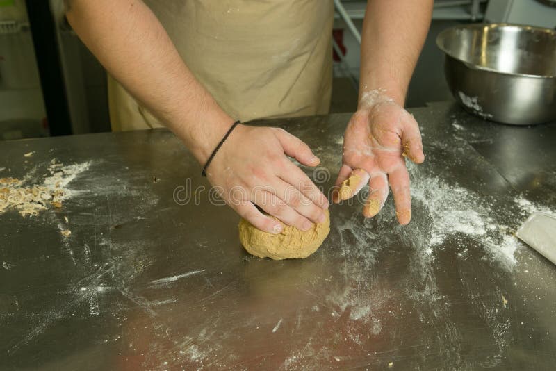 The Process of Making Bread. the Chef Kneads the Dough by Hand Stock ...