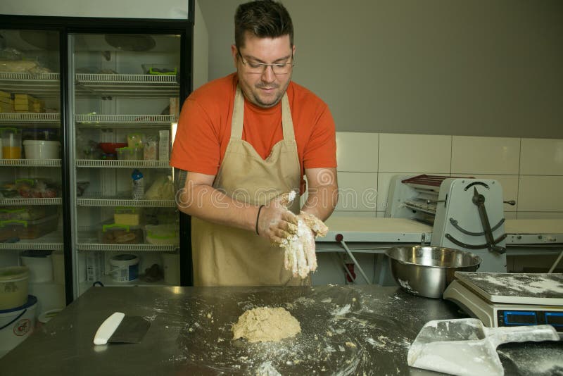 The Process of Making Bread. the Chef Kneads the Dough by Hand Stock ...