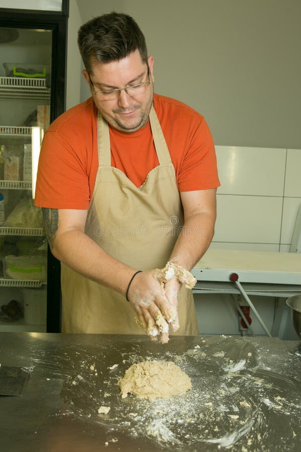 The Process of Making Bread. the Chef Kneads the Dough by Hand Stock ...