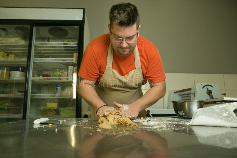 The Process of Making Bread. the Chef Kneads the Dough by Hand Stock ...