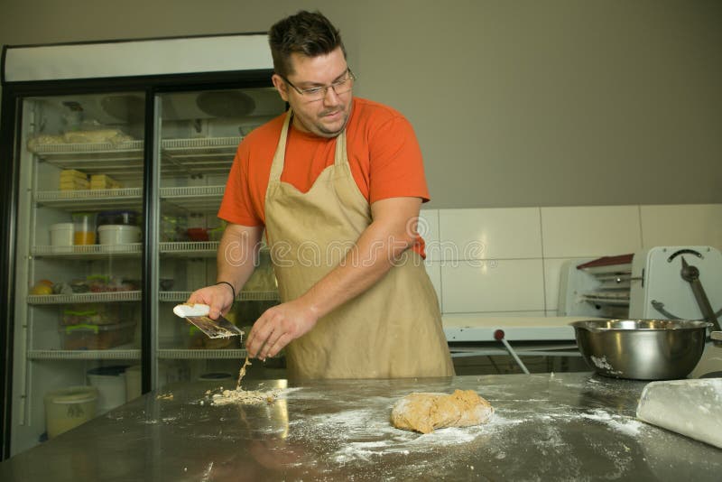 The Process of Making Bread. the Chef Kneads the Dough by Hand Stock ...