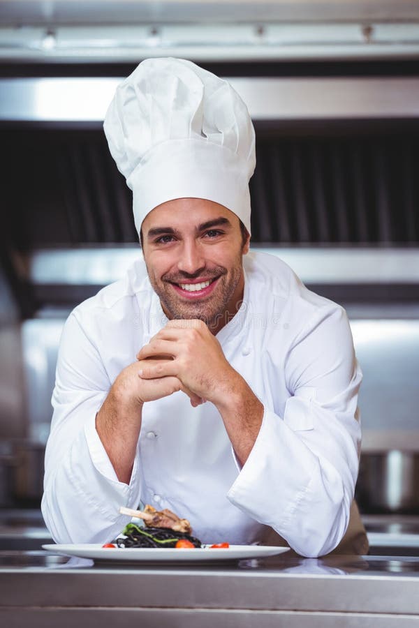 Chef Leaning on the Counter with a Dish Stock Image - Image of ...