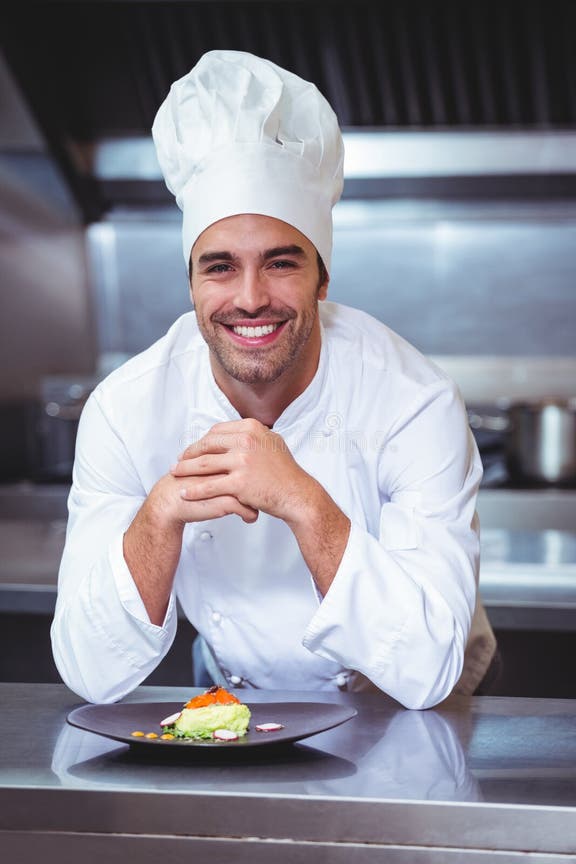 Chef Leaning on the Counter with a Dish Stock Photo - Image of plate ...