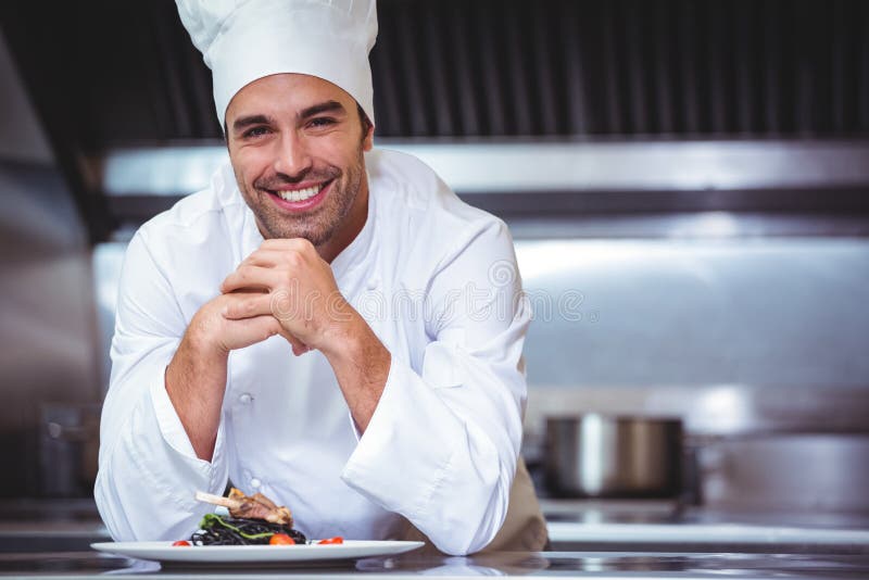 Chef Leaning on the Counter with a Dish Stock Image - Image of ...