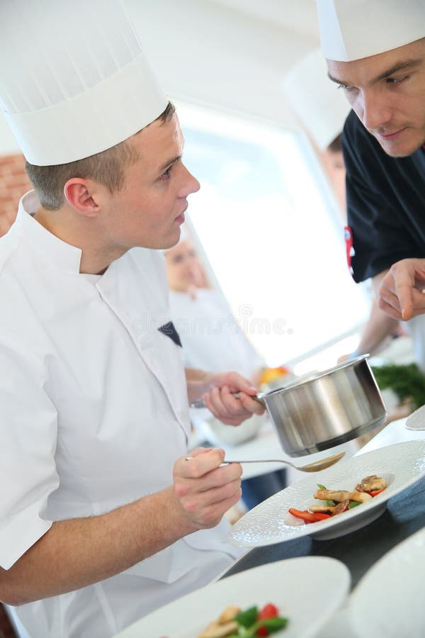 Chef Listening To Young Cooking Apprentice Stock Image - Image of dish ...