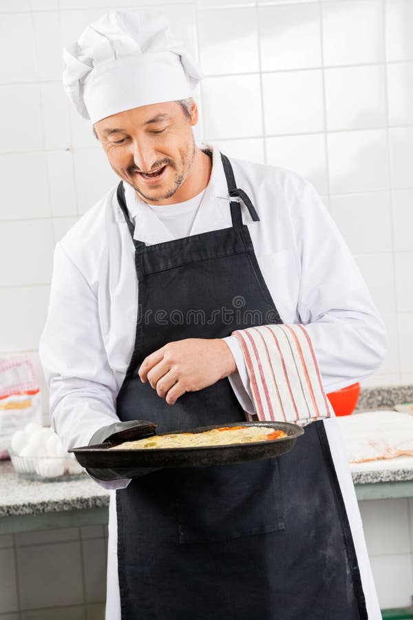 Chef Looking at Fresh in Pan Stock Photo - Image of happy, front: 48655712