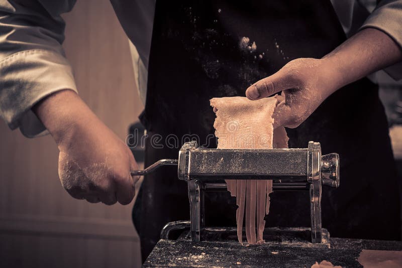 The Chef Makes Fresh Spaghetti from Scratch. Stock Image - Image of ...