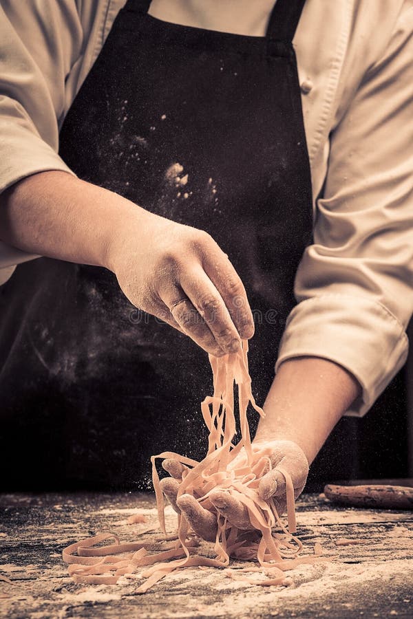 The Chef Makes Fresh Spaghetti from Scratch. Stock Photo - Image of ...