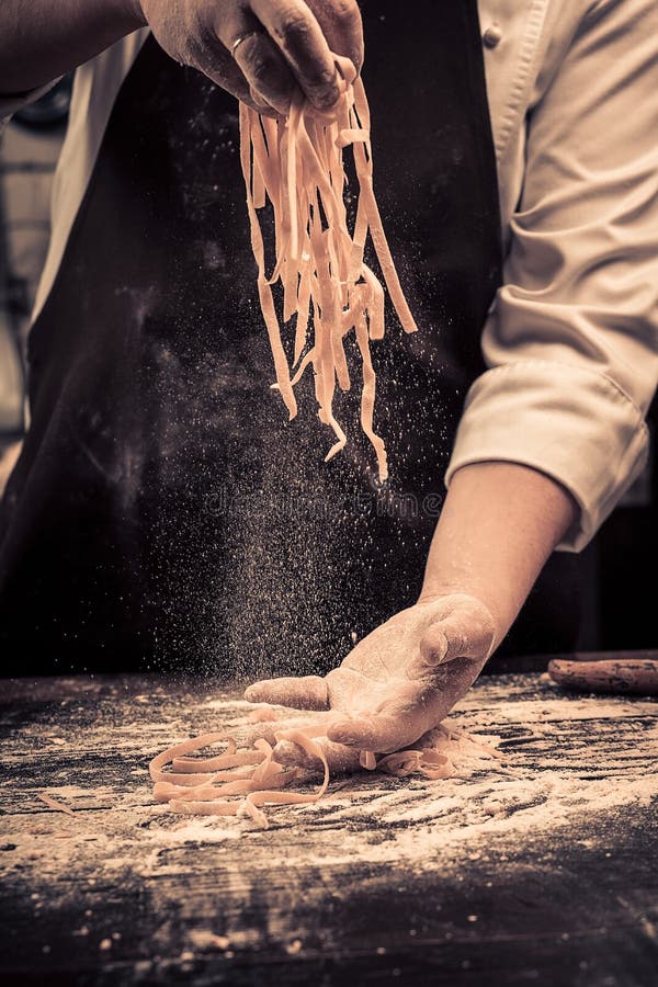 The Chef Makes Fresh Spaghetti from Scratch. Stock Image - Image of ...
