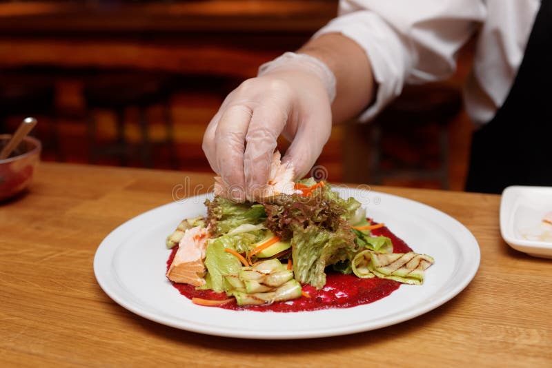 Chef is making appetizer stock photo. Image of decorating - 86501594