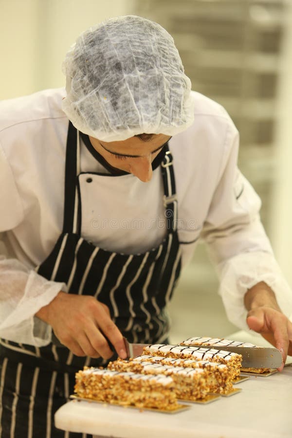 Chef making cake editorial stock photo. Image of cream - 249410438