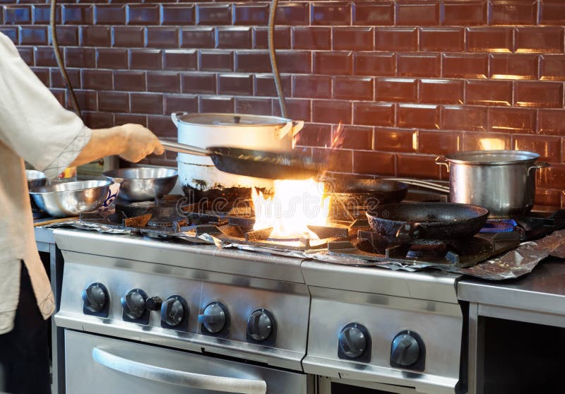 Chef is Making Flambe Dish in Restaurant Kitchen Stock Image - Image of ...