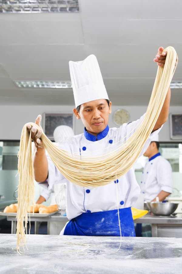 Chef making noodle stock image. Image of vertical, focus - 14048655