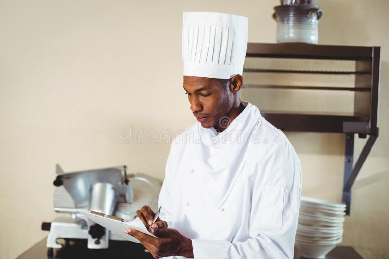 Chef Making Notes on a Clipboard Stock Image - Image of whites, indoors ...