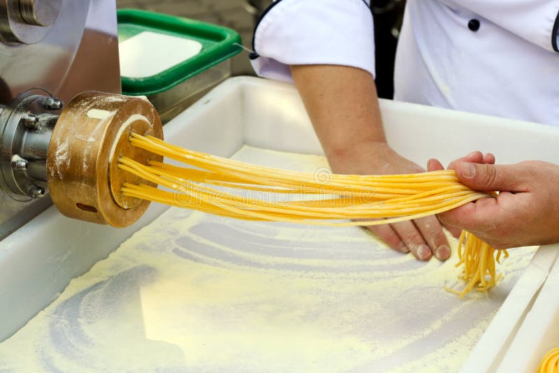 Chef Making Pasta with Machine Stock Photo - Image of food, hands: 33429774
