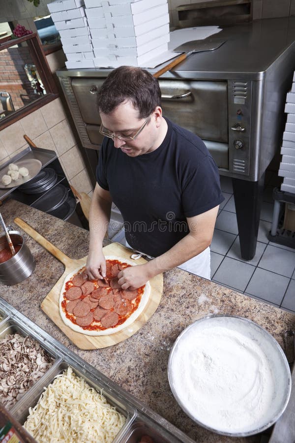 Chef Making Pizza at Kitchen Stock Photo - Image of chef, board: 35589184