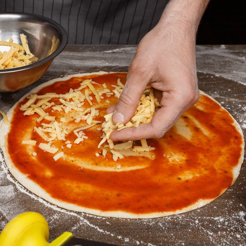 Chef Making the Pizza, Adding Cheese on Pizza Base Stock Photo - Image ...