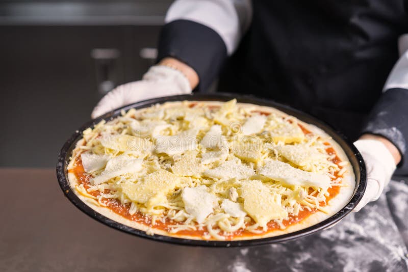 Chef Making Pizza with Cheese at Kitchen. Stock Photo - Image of melted ...