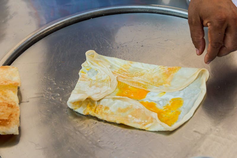 Chef making roti and egg stock photo. Image of cooking - 152196460