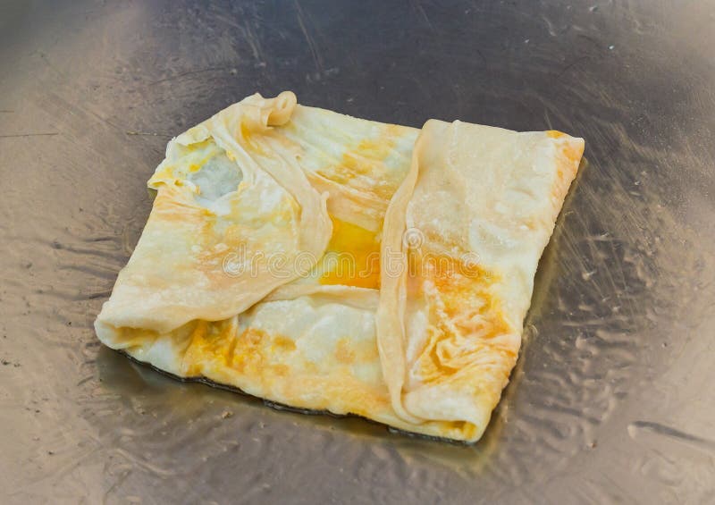 Chef making roti and egg stock photo. Image of street - 152196546