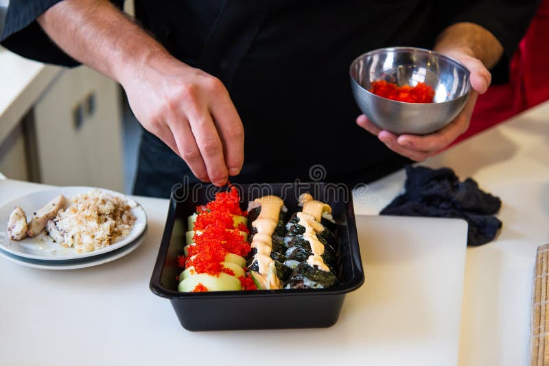 Chef Making Sushi in the Bar Stock Photo - Image of dish, kitchen ...