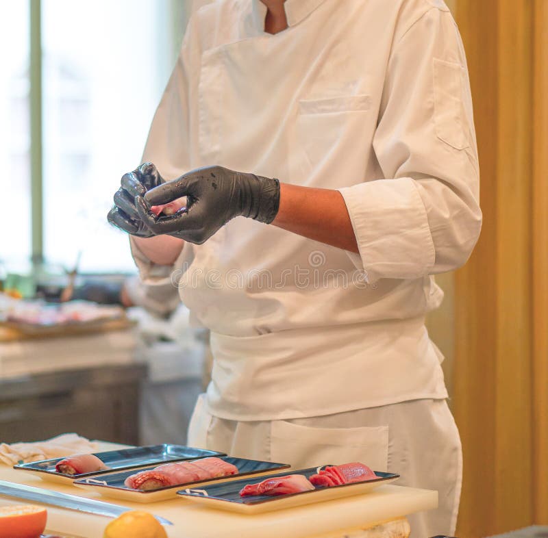 Chef is Making Sushi at a Bar Stock Image - Image of japanese, person ... Chef is Making Sushi at a Bar Stock Image - Image of japanese, person ...